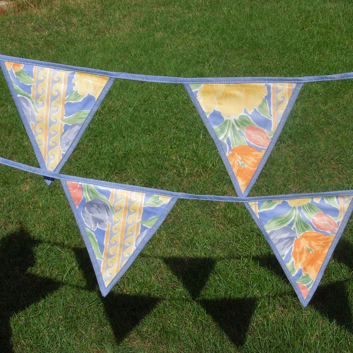 Cotton Bunting - Coloured Flowers on Blue - Handmade – Fabric and Ribbon